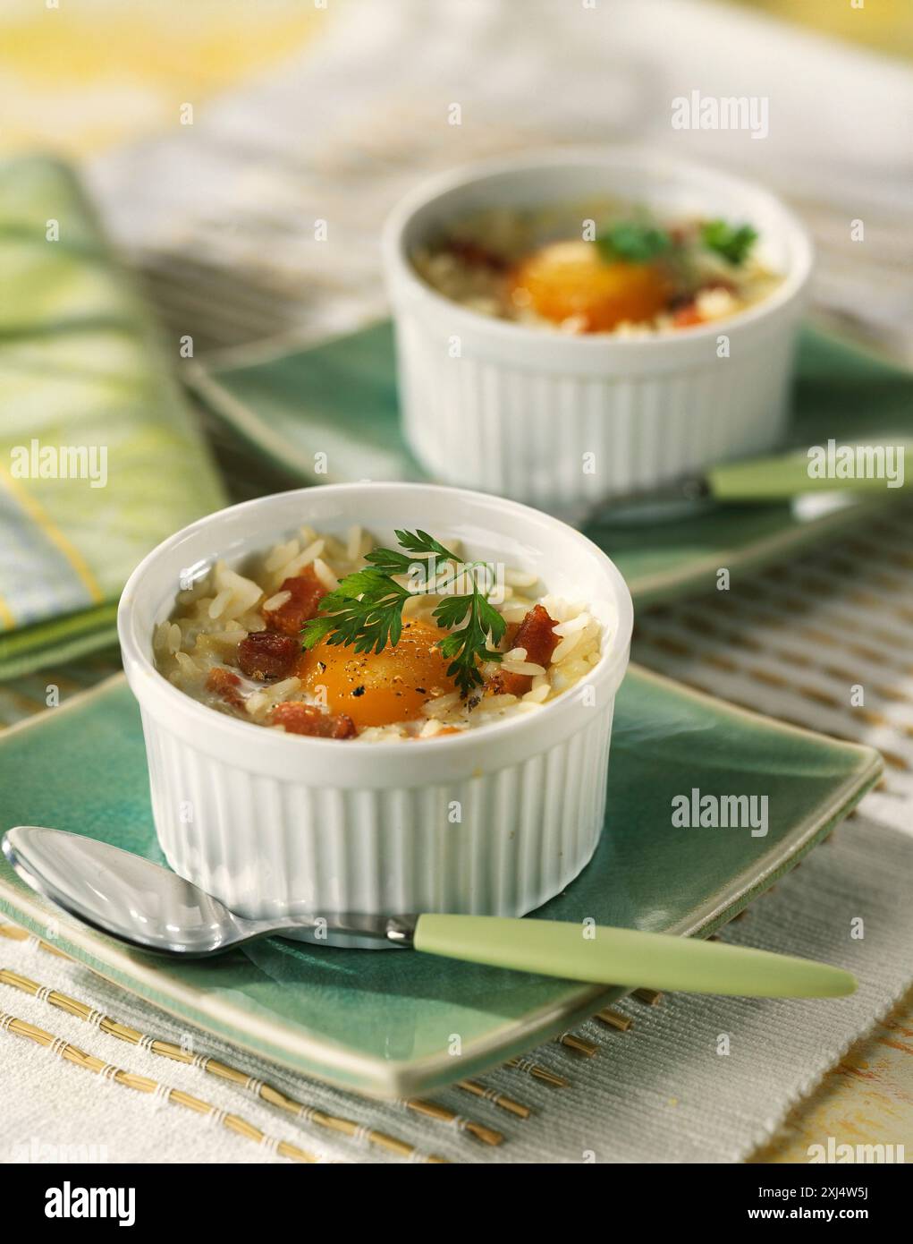 Coddled egg with diced bacon and rice Stock Photo - Alamy