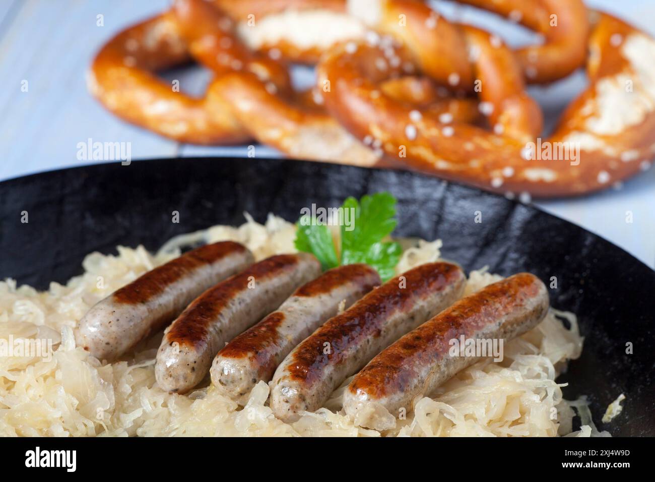 Nuremberg bratwurst on cabbage in a pan Stock Photo - Alamy