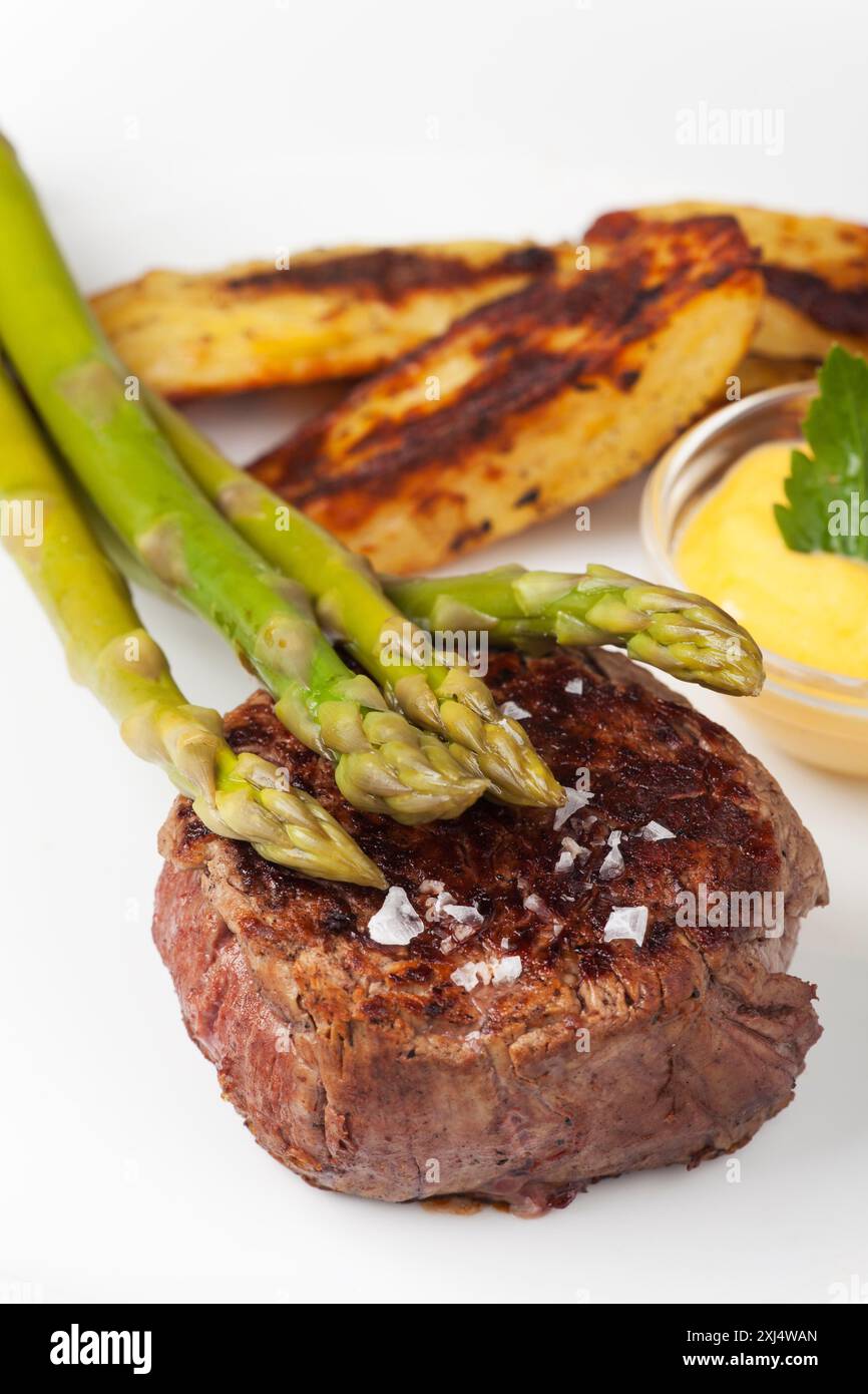 Beef steak and asparagus with potatoes Stock Photo - Alamy