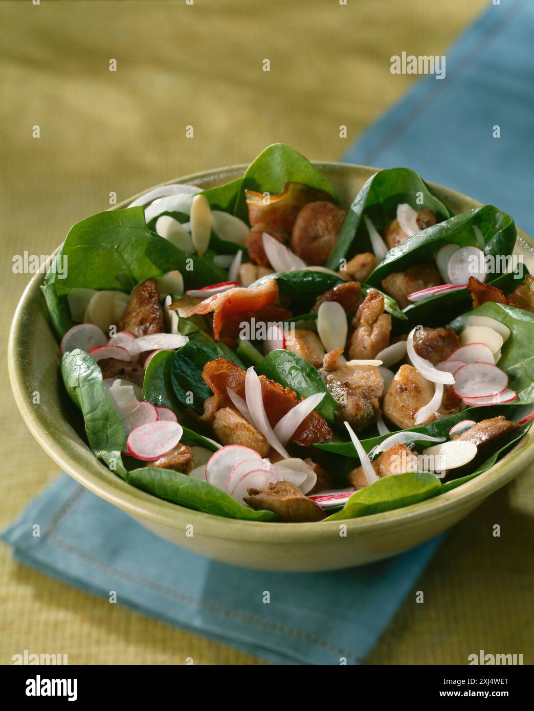 Fresh spinach,radish,chicken liver and bacon salad Stock Photo - Alamy