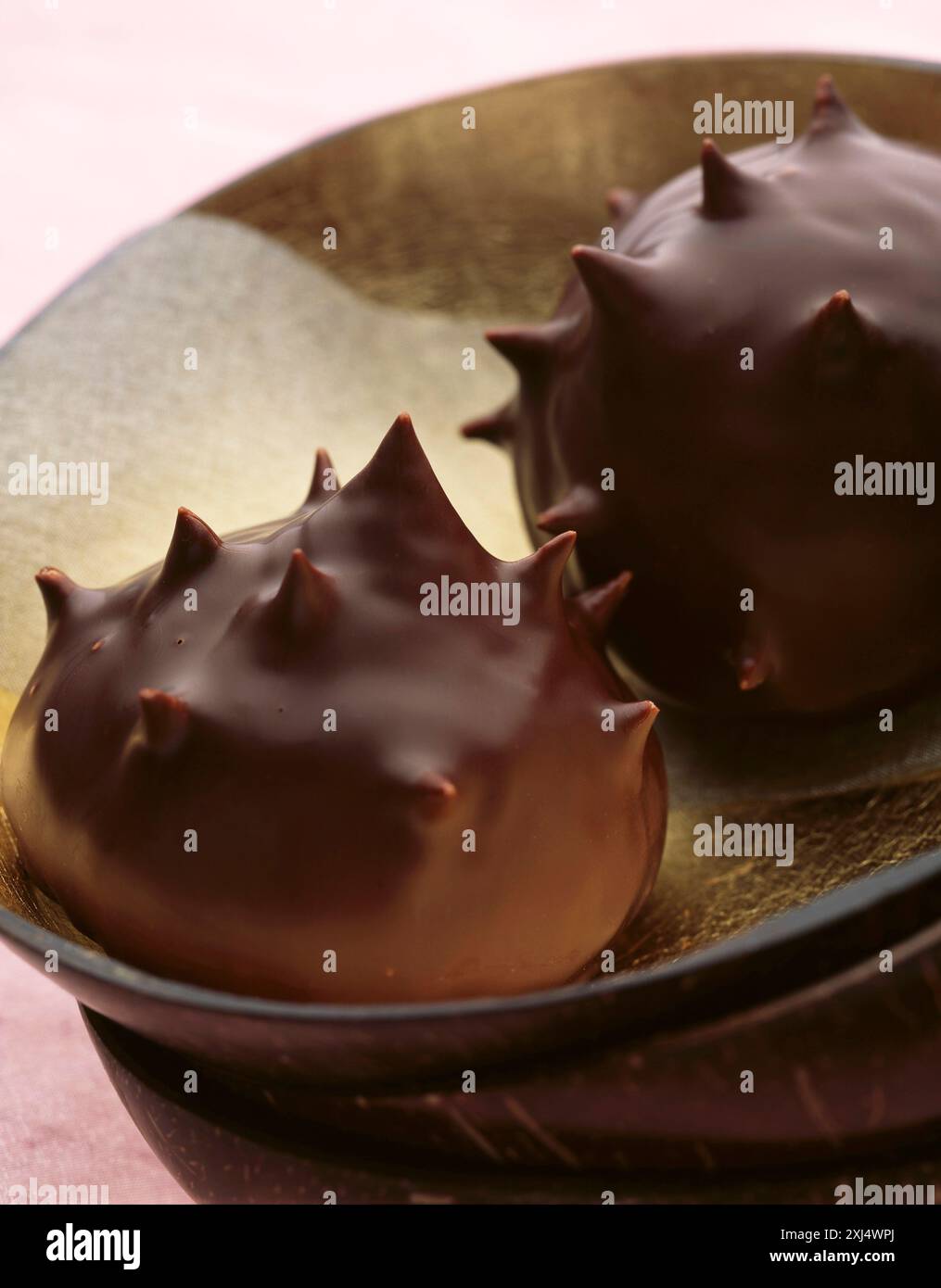 Coconut dark chocolates Stock Photo - Alamy