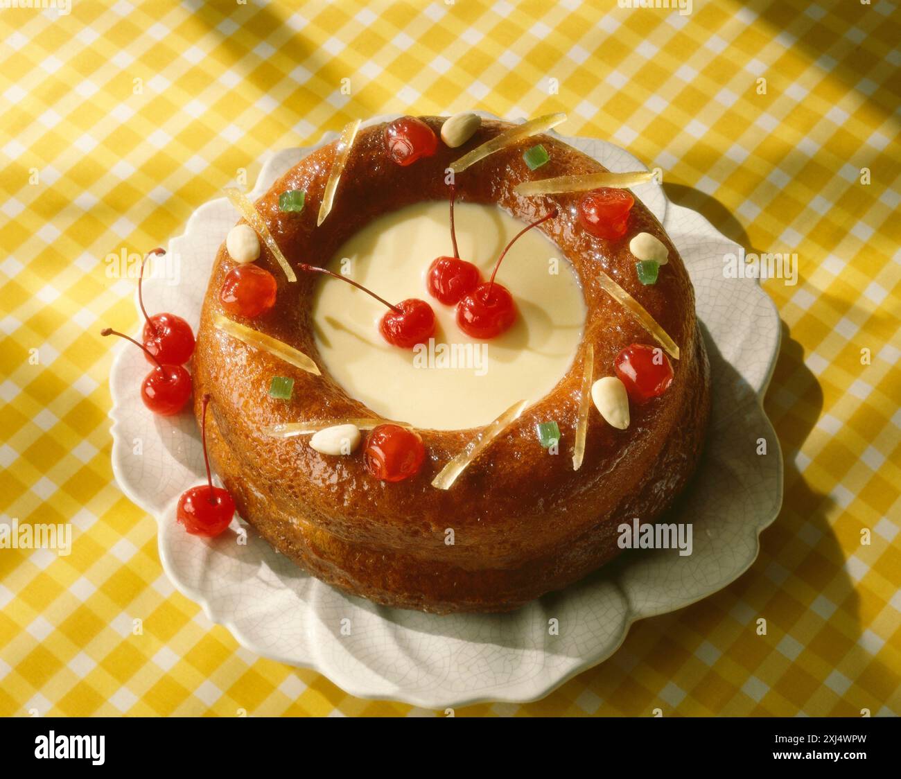 Baba with rum,confit fruit and custard Stock Photo - Alamy