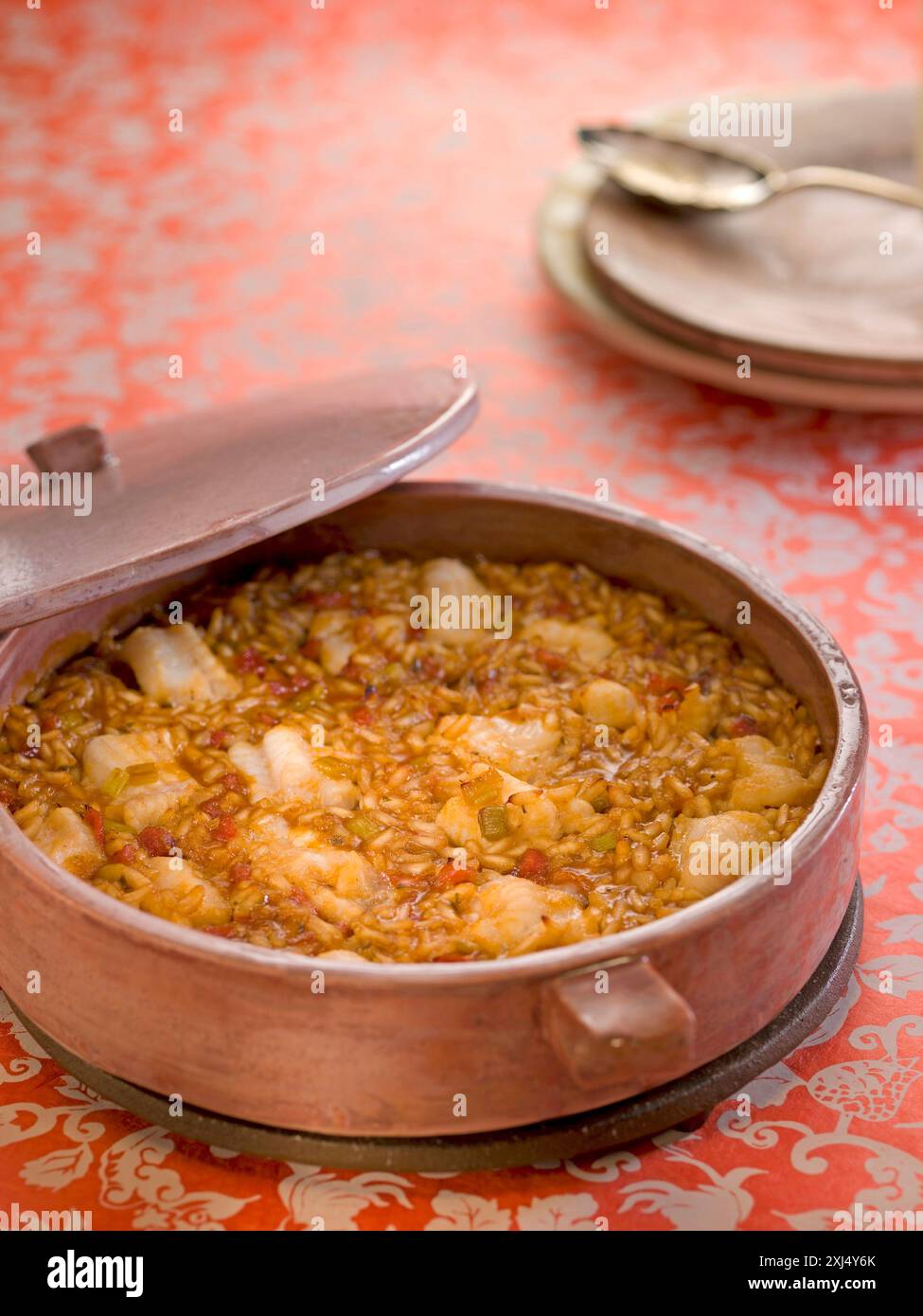 Cooking pot of conger eel and bomba rice Stock Photo - Alamy
