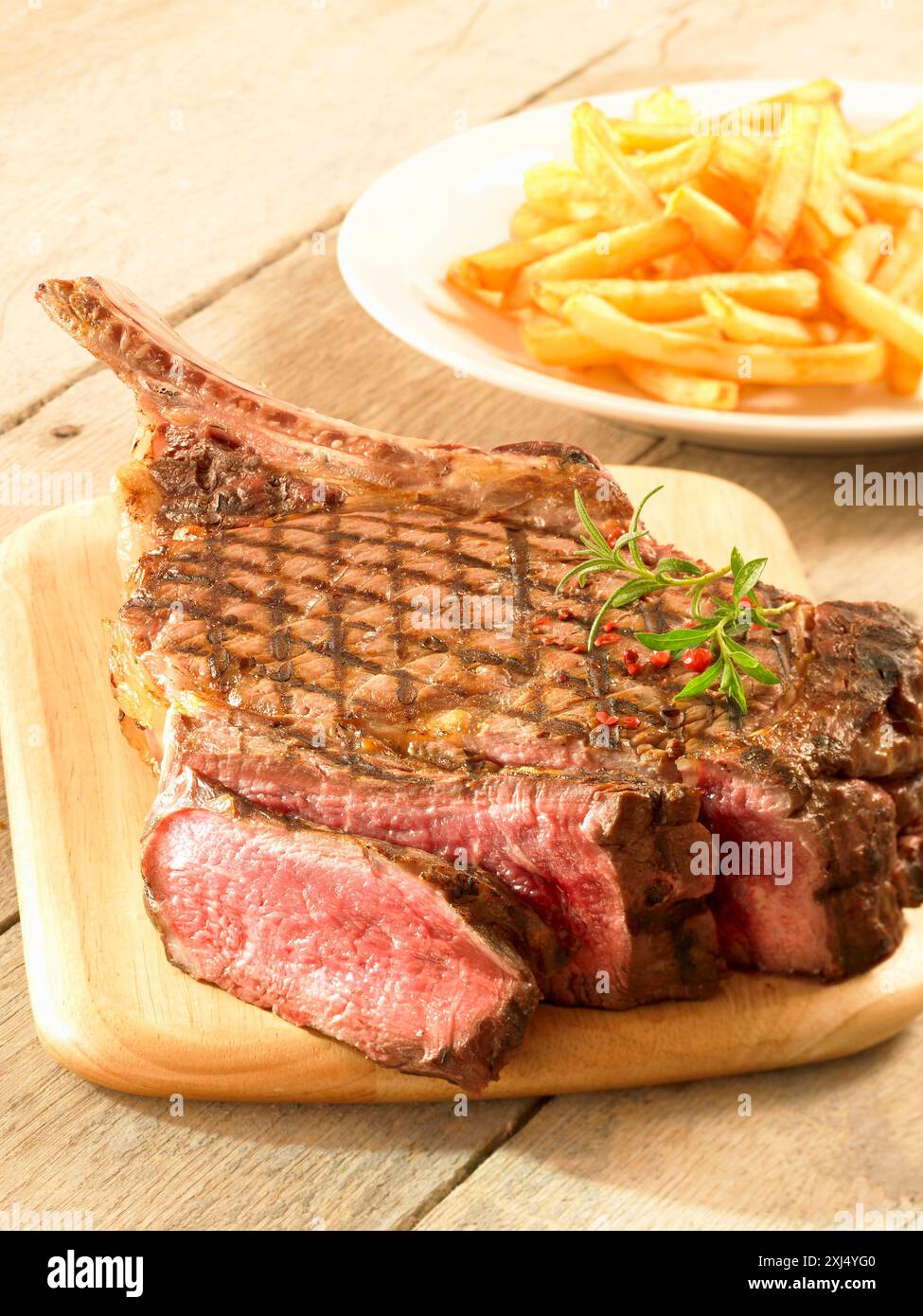 Grilled beef chop and chips Stock Photo - Alamy