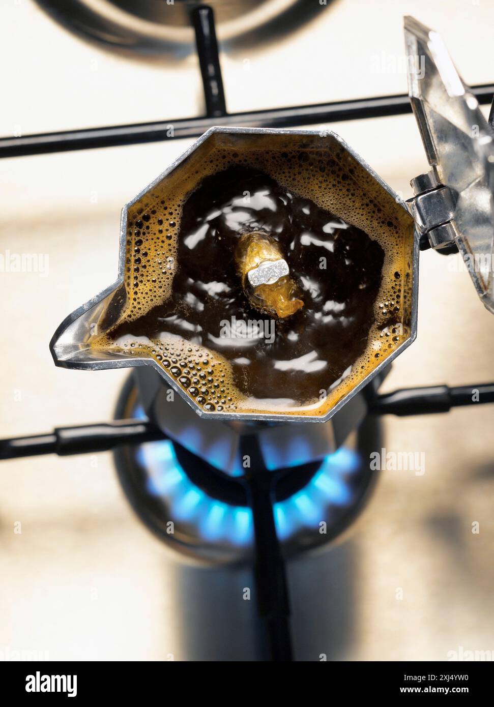 Italian coffee machine on a gas cooker Stock Photo - Alamy