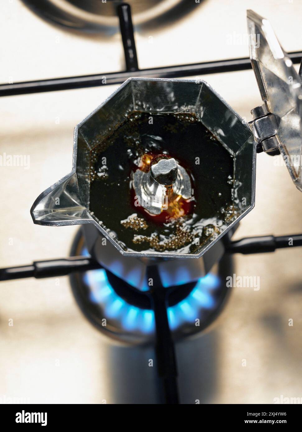 Italian coffee machine on a gas cooker Stock Photo - Alamy