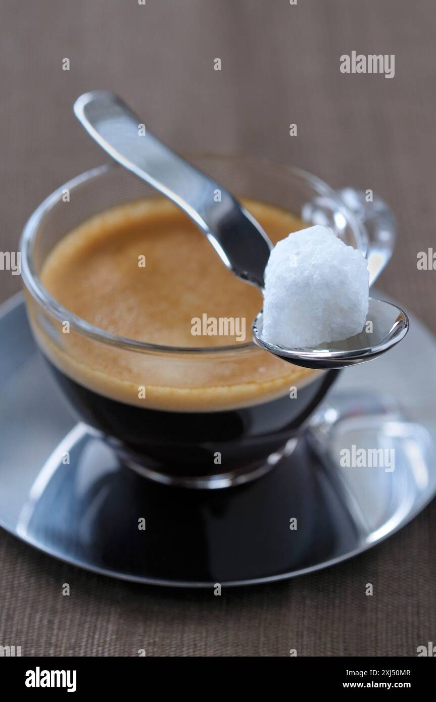 Cup of expresso a white sugar lump Stock Photo - Alamy