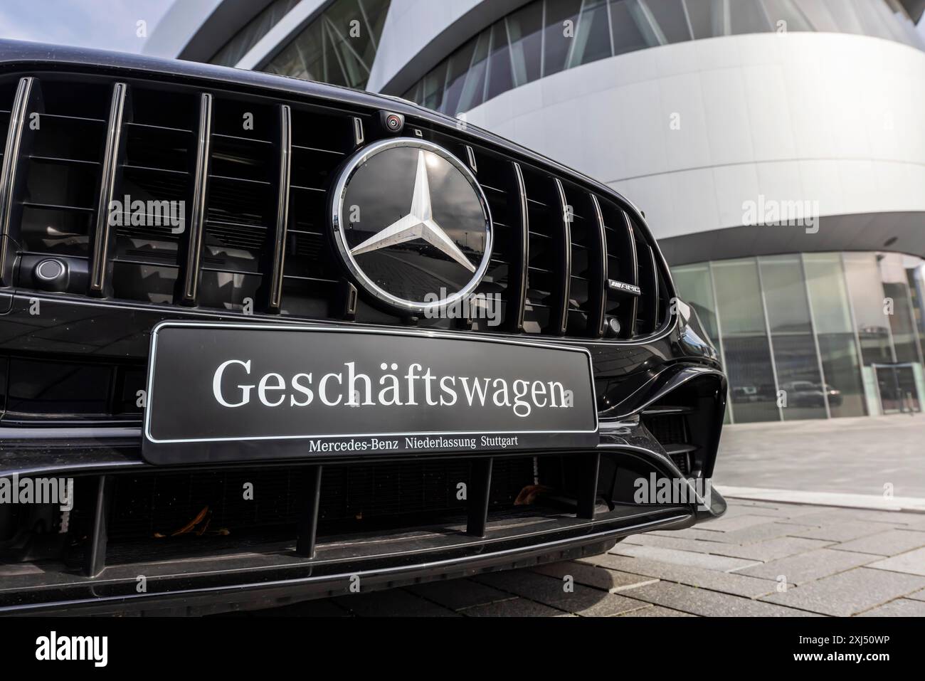 Mercedes company car, radiator grille and Mercedes star on a modern ...