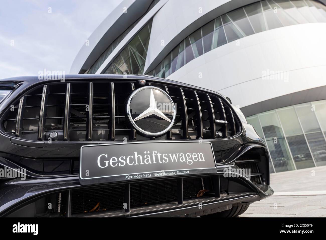 Mercedes company car, radiator grille and Mercedes star on a modern ...