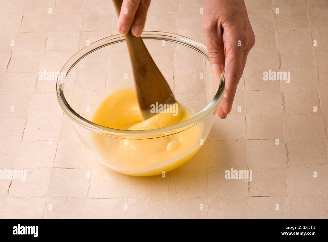 Mixing together the eggs and the sugar Stock Photo - Alamy