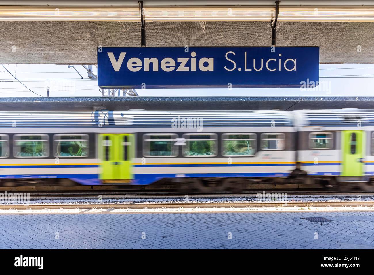 Venezia Santa Lucia railway station with regional train, station sign ...