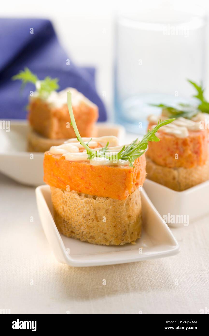 Crab pudding on a bite-size slice of bread Stock Photo - Alamy