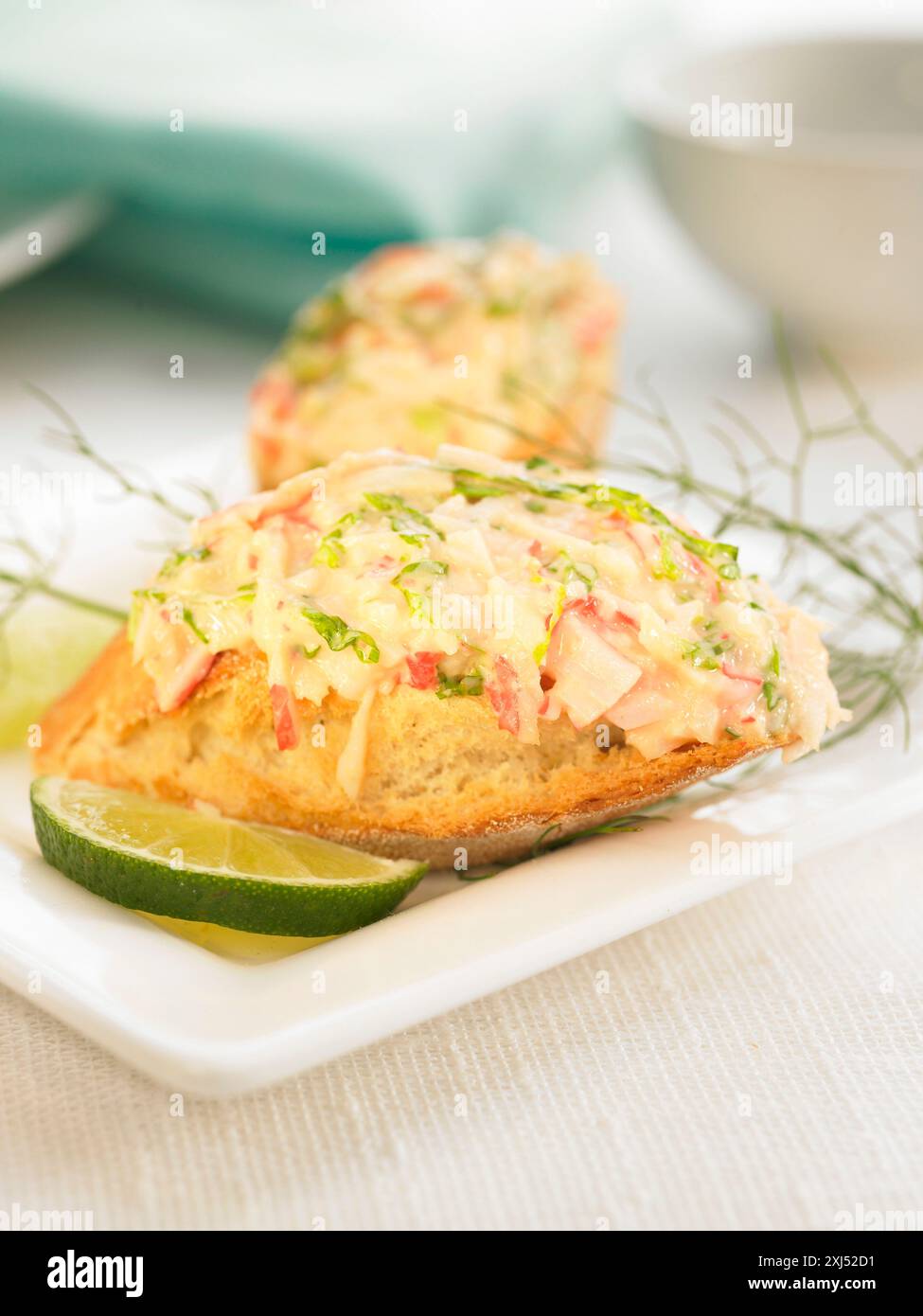 Crab salad on a bite-size slice of bread Stock Photo - Alamy