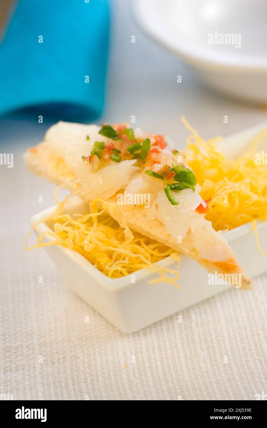 Smoked cod and pepper canapé Stock Photo - Alamy