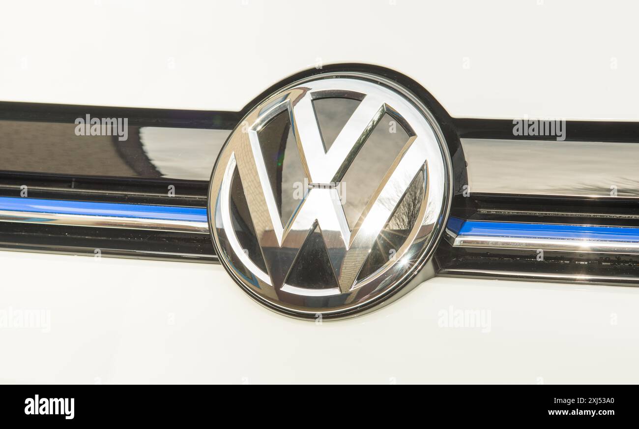 Shiny, silver logo of the Volkswagen company, emblem with chrome effect ...