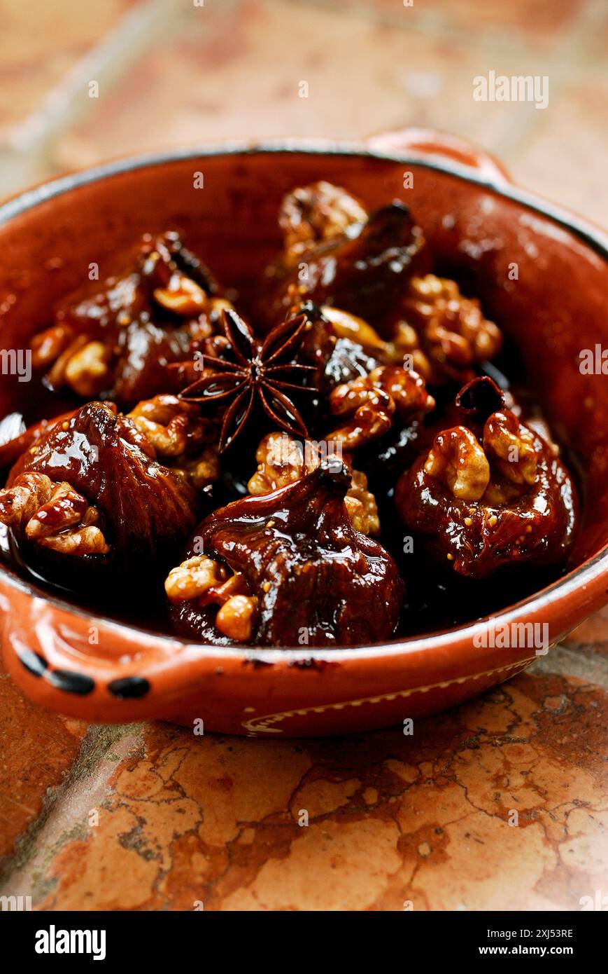Dried figs with caramel ,walnuts and star anise Stock Photo - Alamy