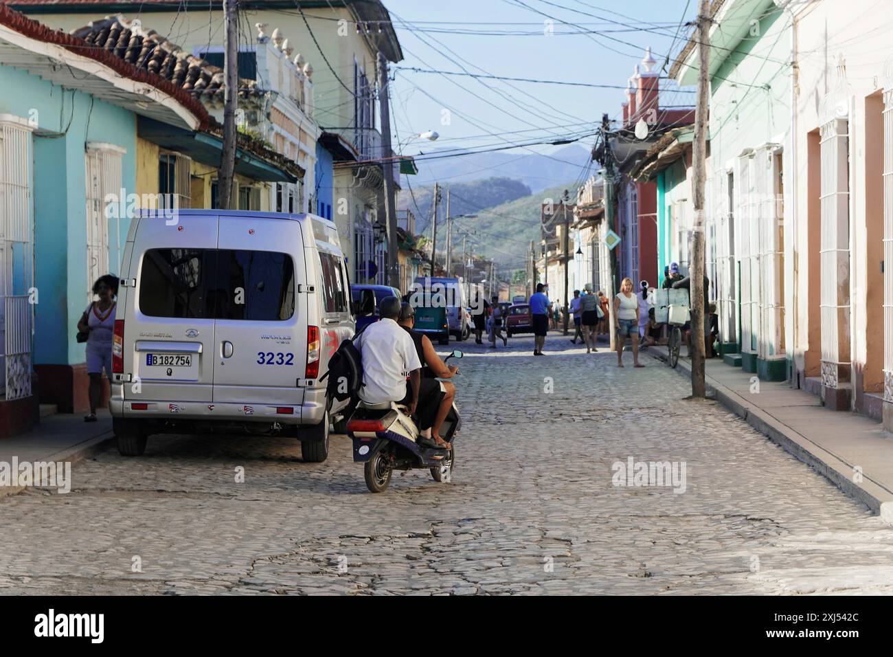 Trinidad, Cuba, Central America, Street scene in a city with cars ...