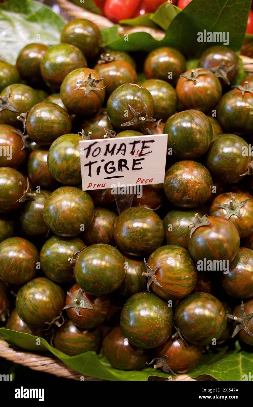 Green zebra tomatoes on a stall Stock Photo - Alamy