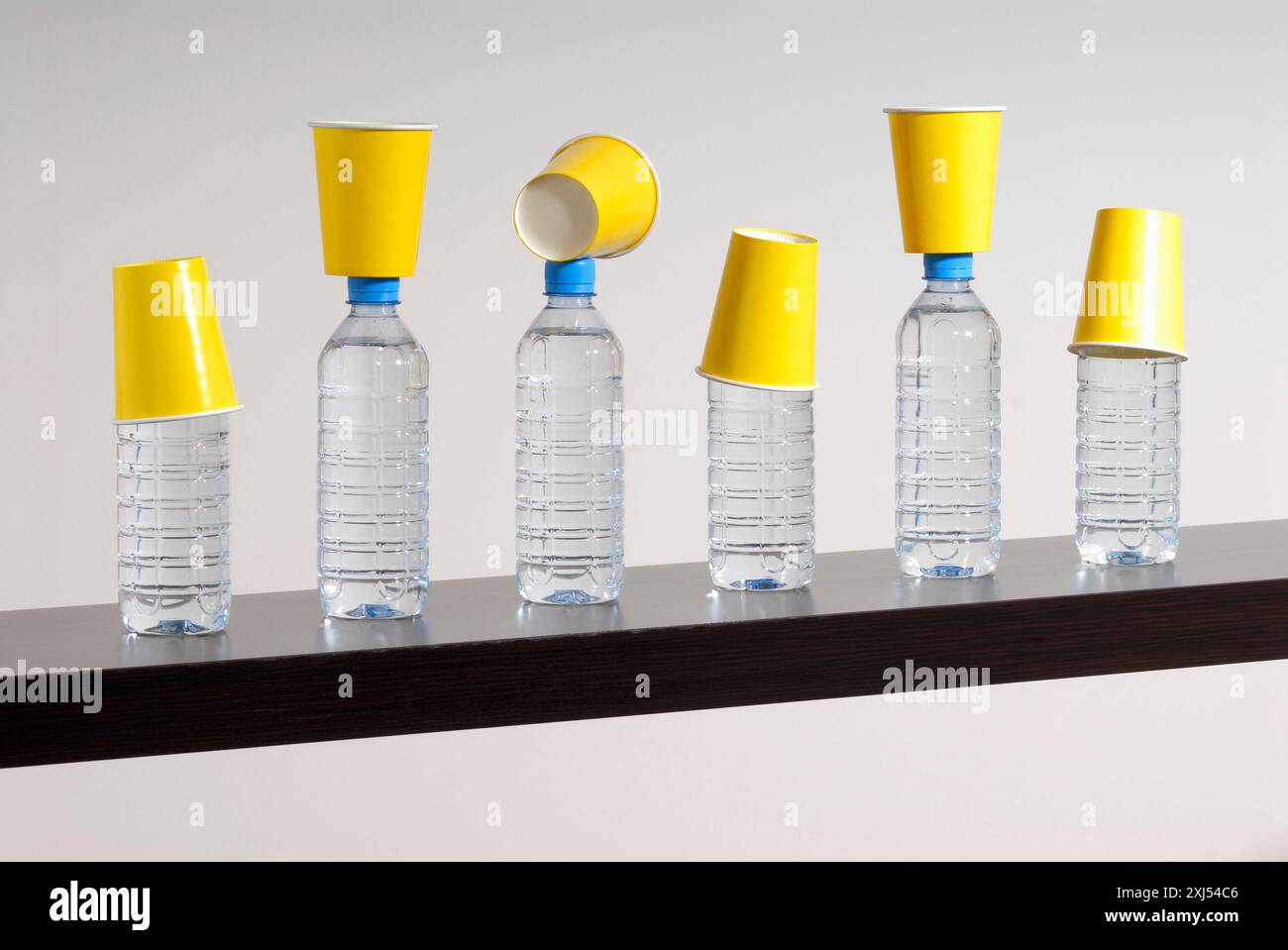 Plastic cups and bottles of water Stock Photo - Alamy