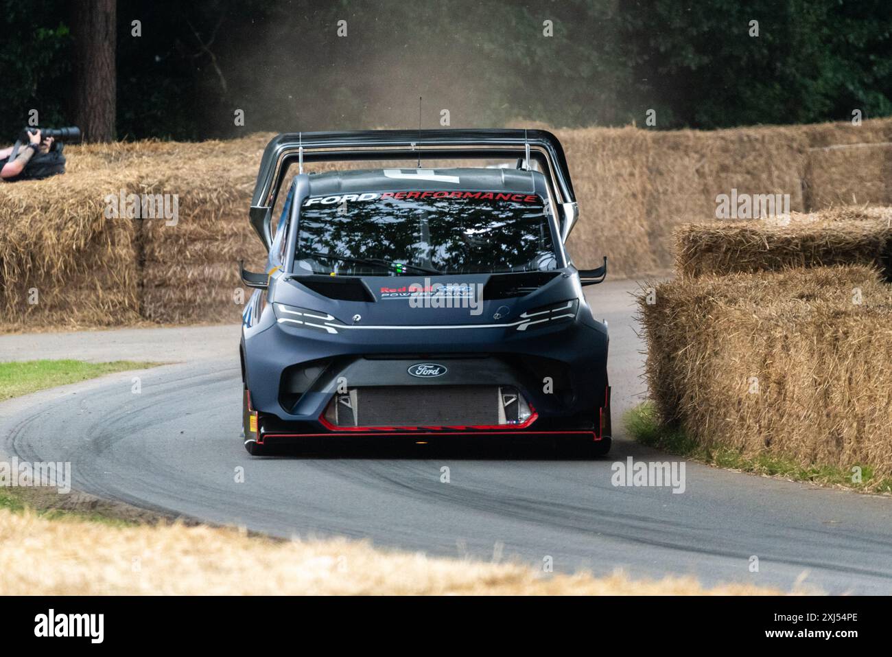 Ford Supervan 4.2 van racing up the hill climb track at the Goodwood ...