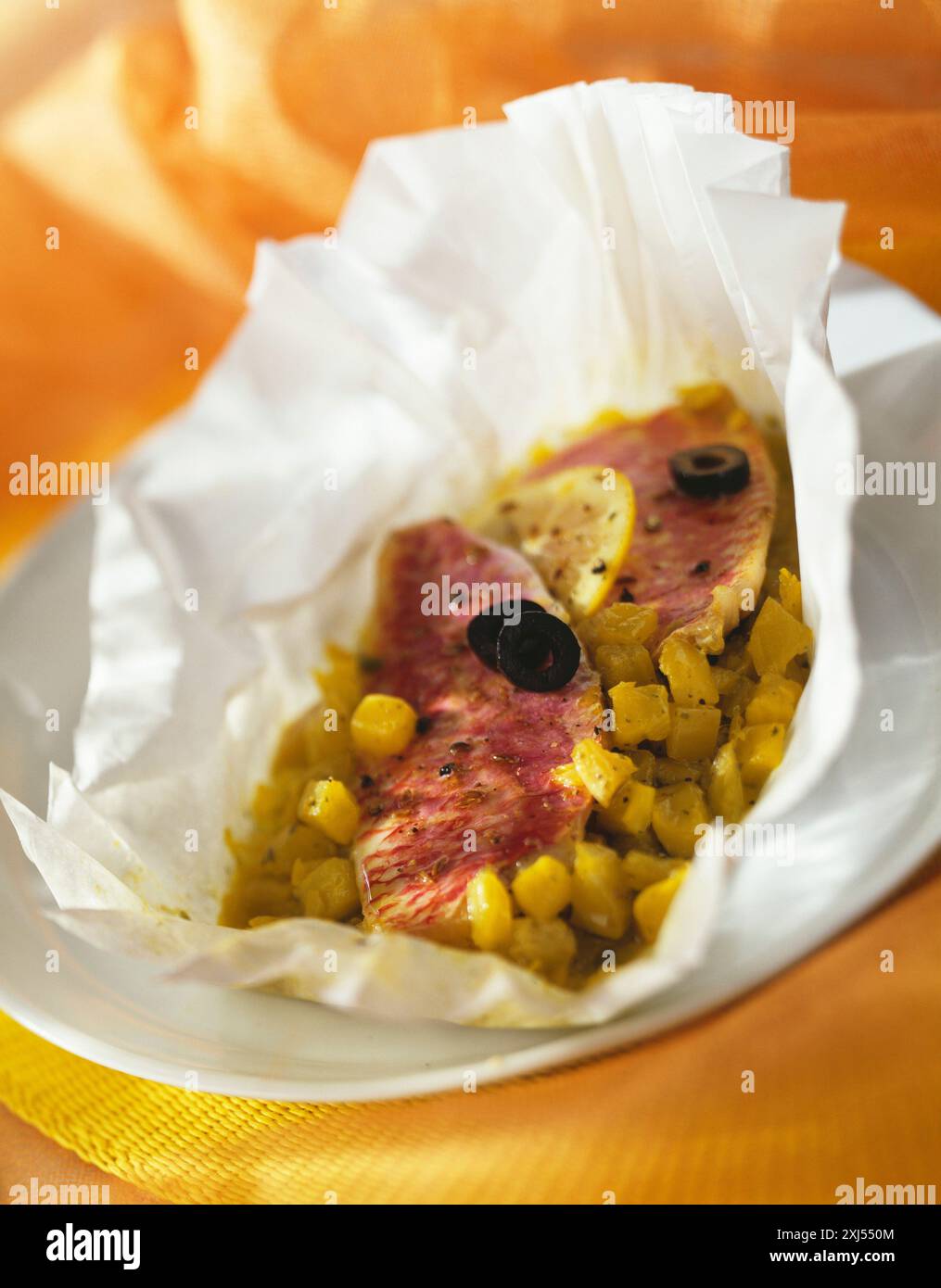 Red mullet fillets, fennel and olive cooked in greaseproof paper Stock ...