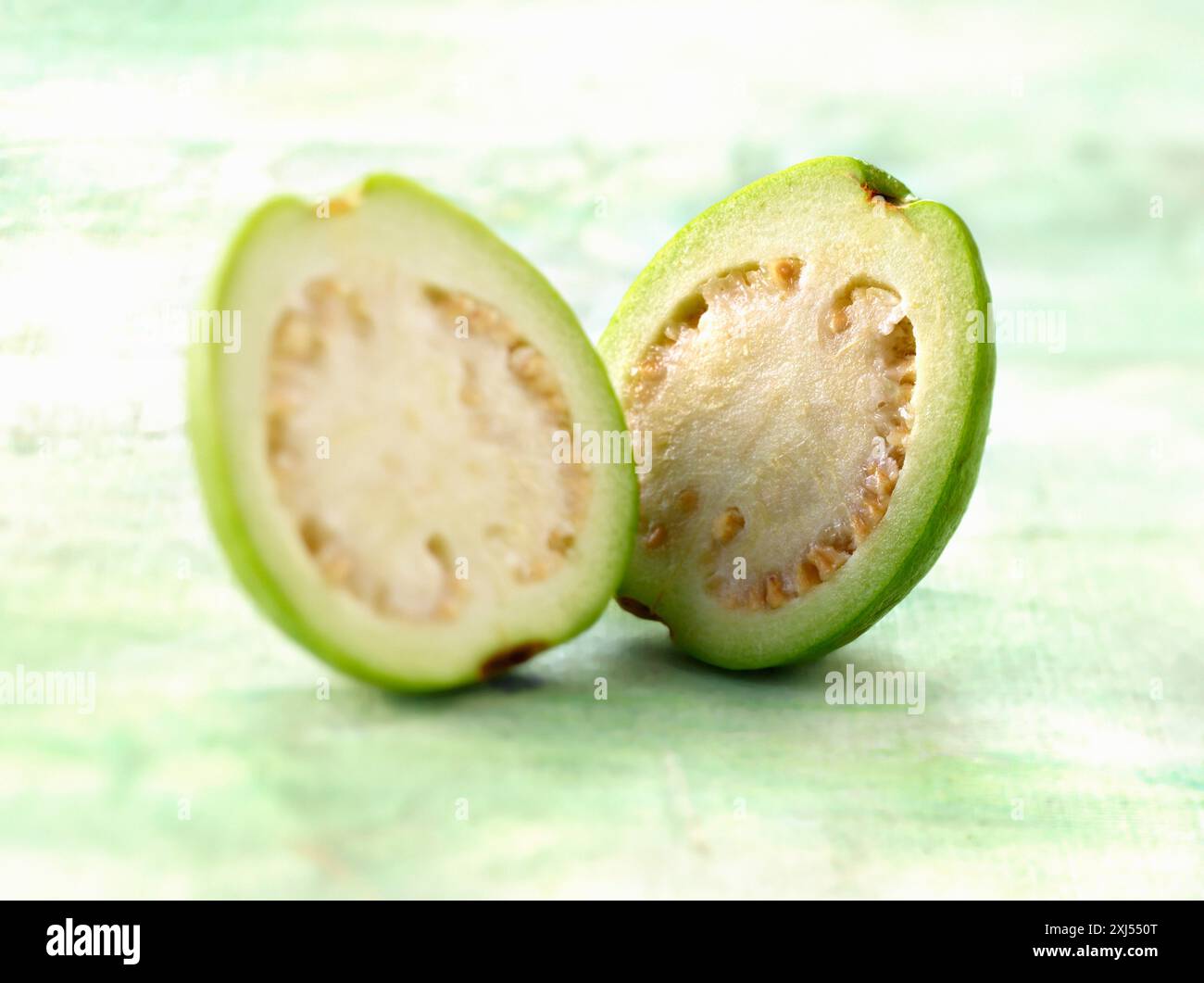 Guava cut in half Stock Photo - Alamy