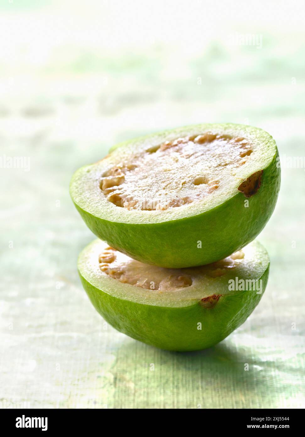 Guava cut in half Stock Photo - Alamy