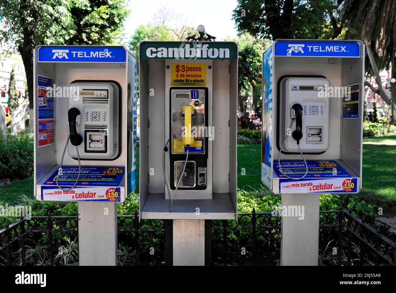 Puebla, Mexico, Central America, Three public outdoor telephone booths ...