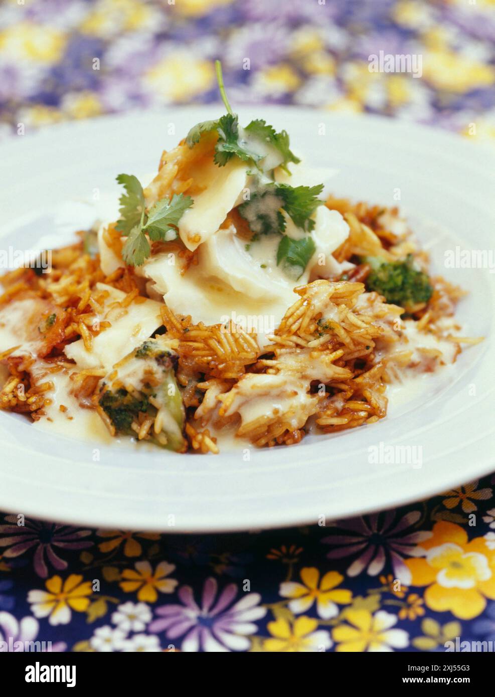 Fish cooked in court-bouillon with pan-fried rice and coriander Stock ...