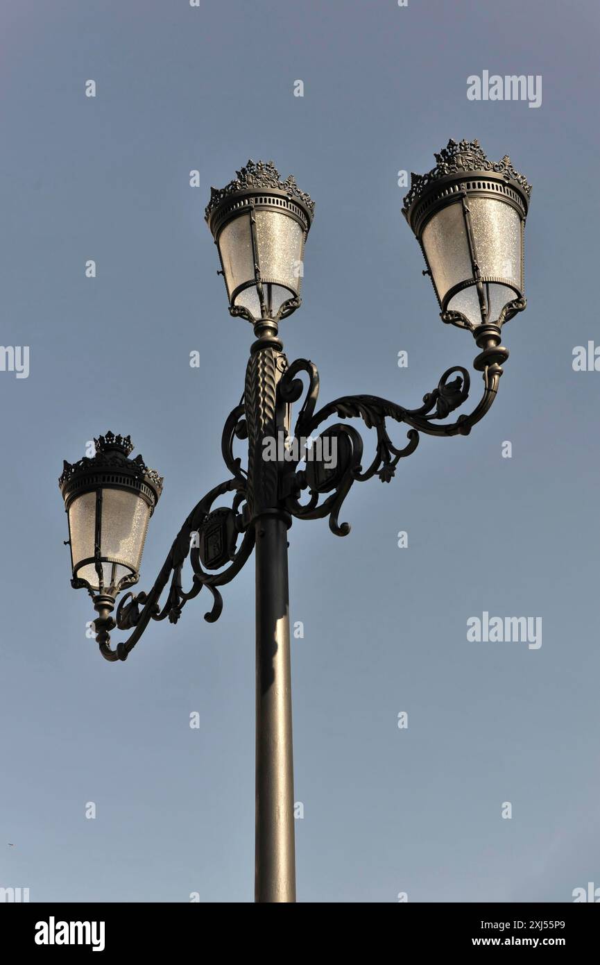 Madrid, Spain, Europe, Historic street lamp with three decorated lamps ...