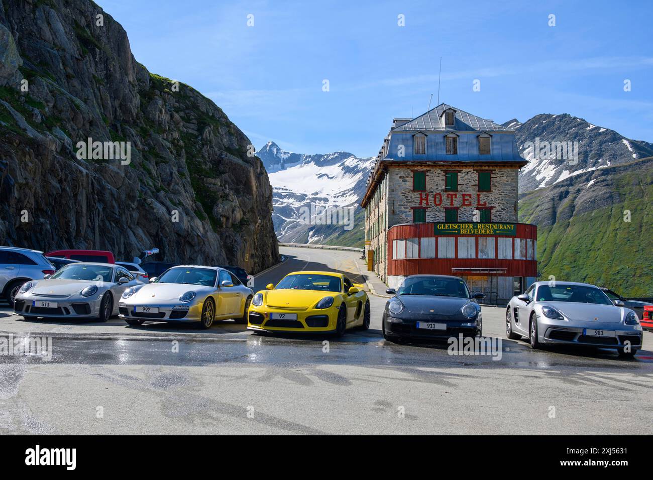 Five Porsche sports cars parked in front of abandoned former now closed ...