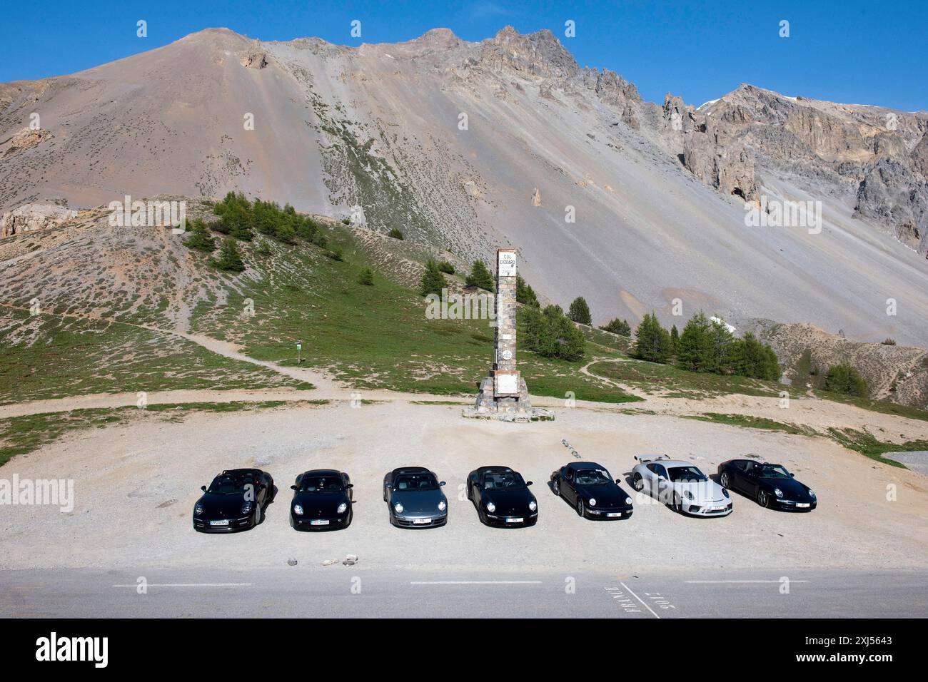 Seven Porsche sports cars parked in the car park of the Col de l'Izoard ...