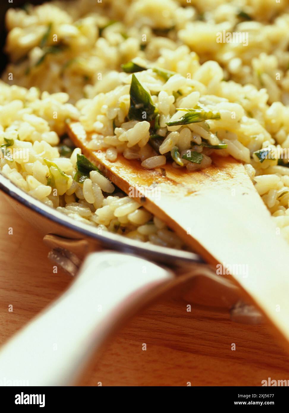 Cooking herb risotto Stock Photo - Alamy