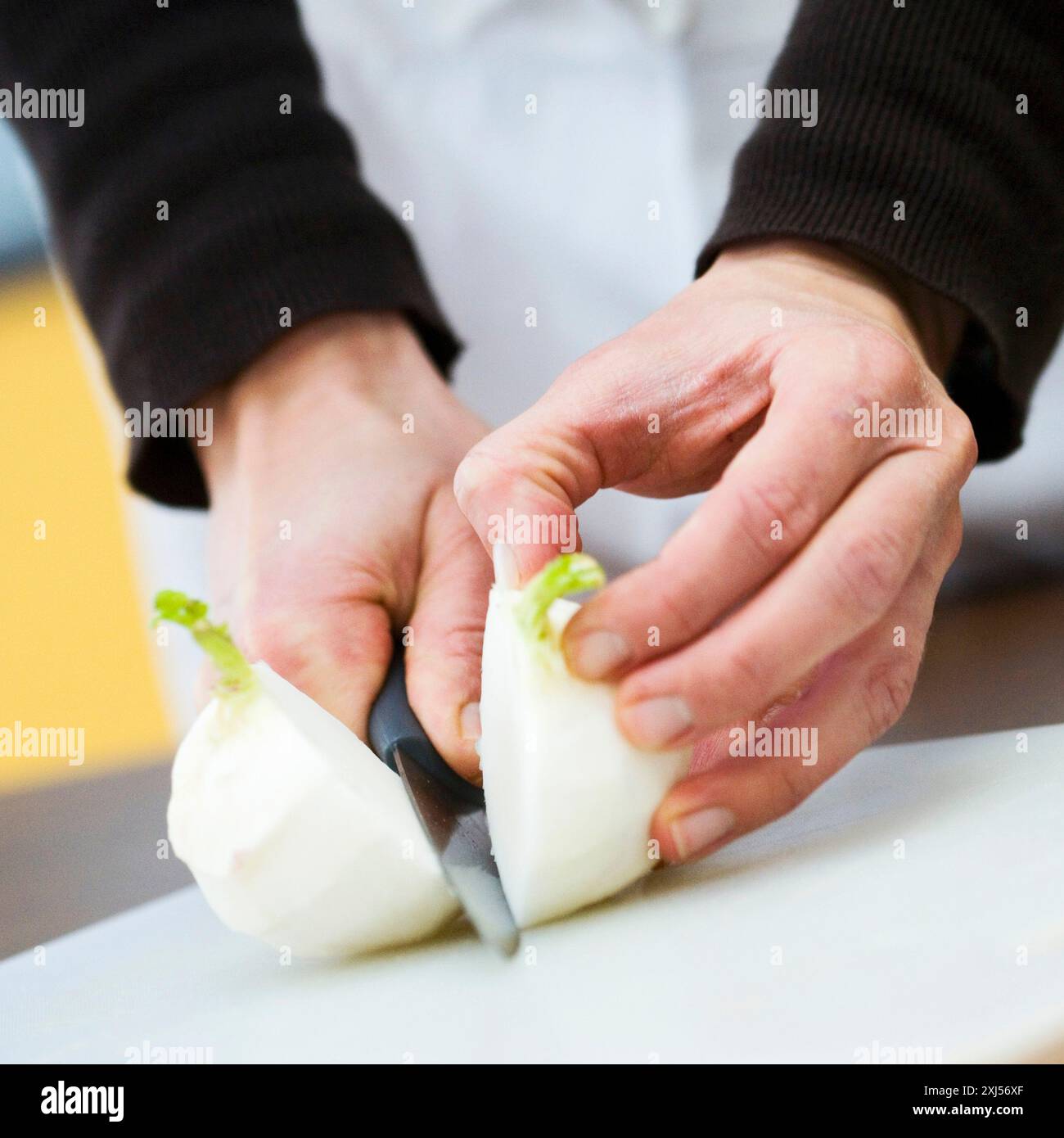 Cutting a turnip in half Stock Photo - Alamy