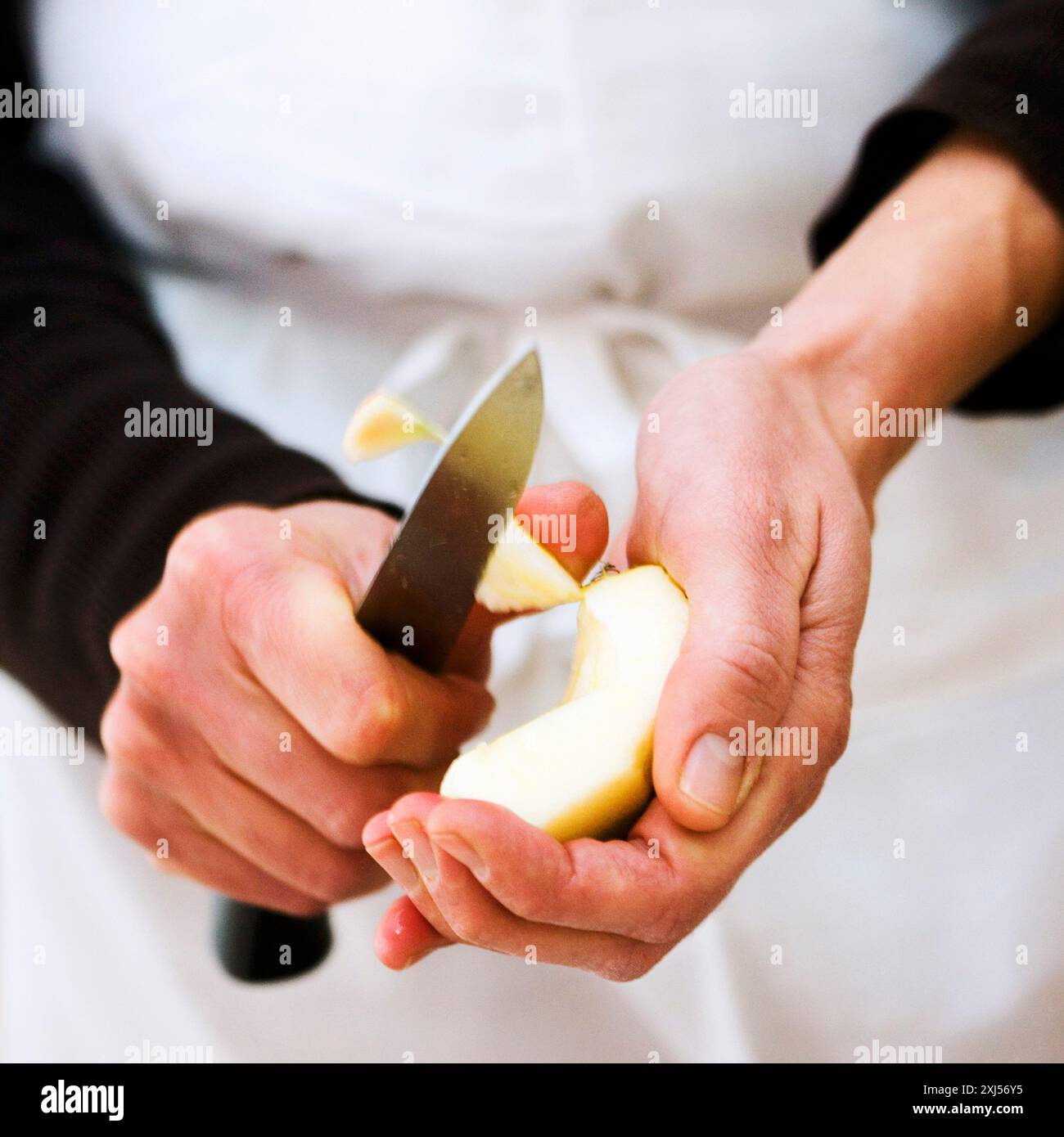 Cutting the core out of the apple Stock Photo - Alamy