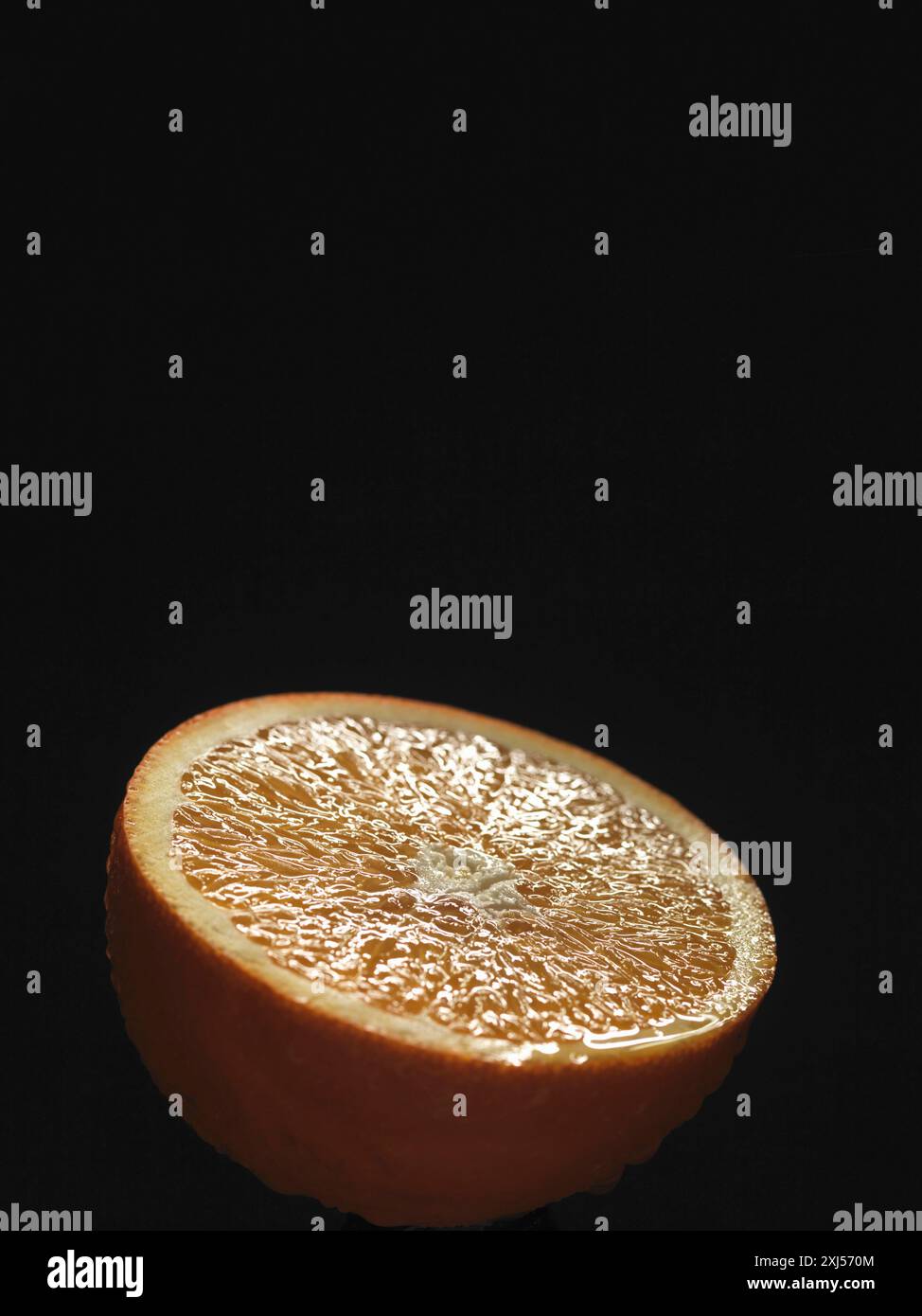 Half an orange Stock Photo - Alamy