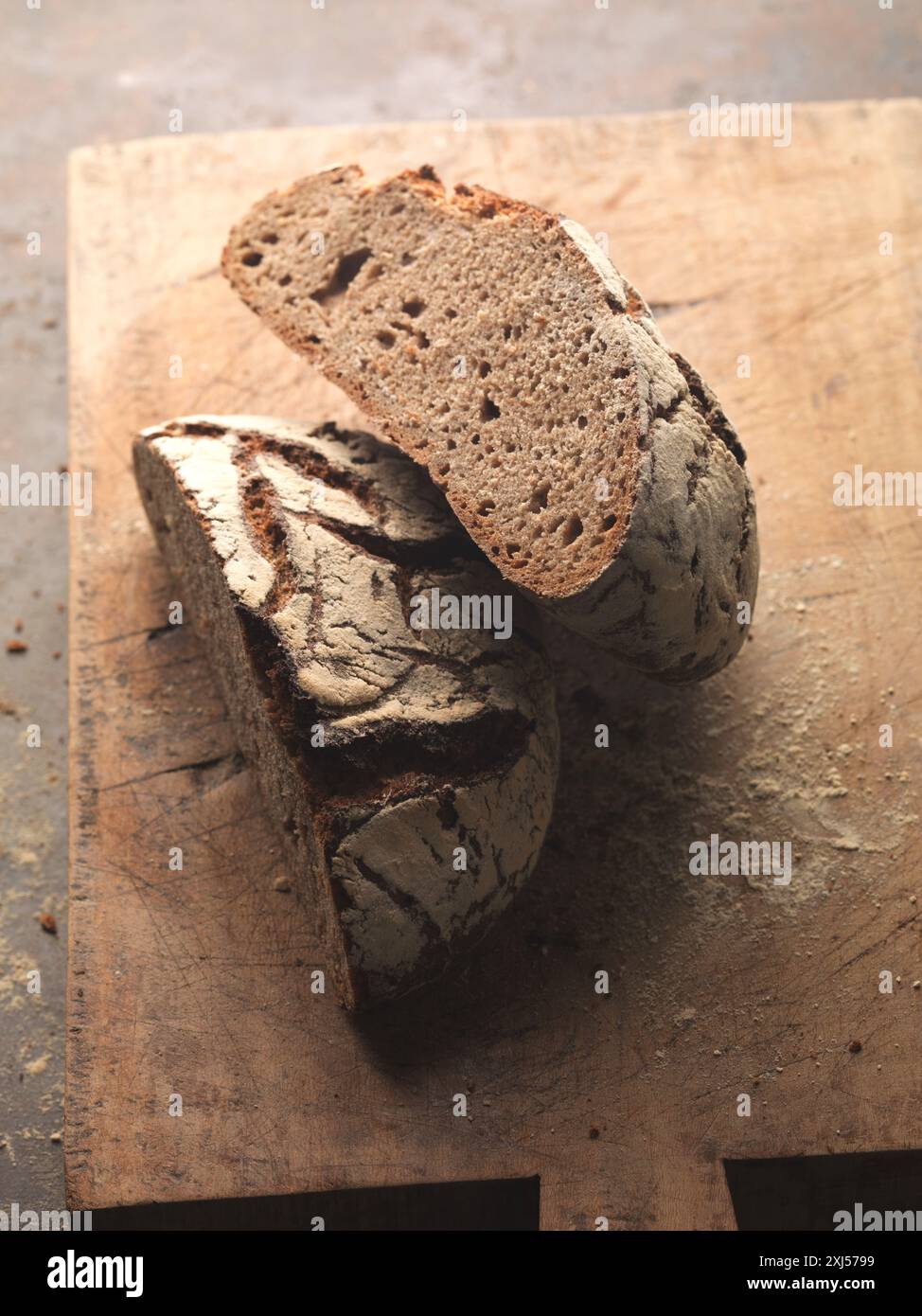Round loaf of bread cut in half Stock Photo - Alamy