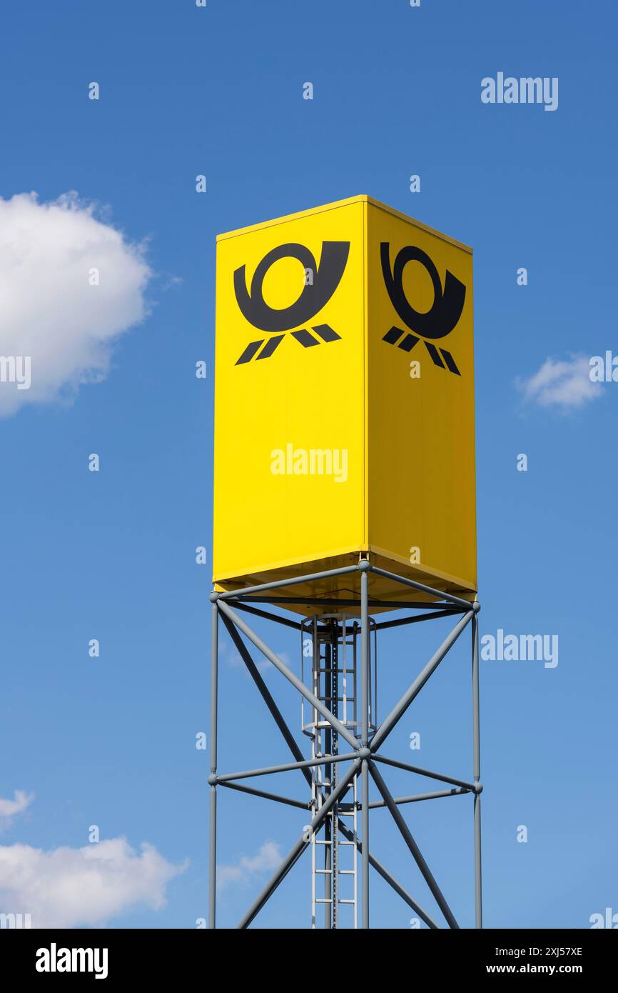 Deutsche Post logo on a scaffold, DHL, blue sky with clouds, Baden ...