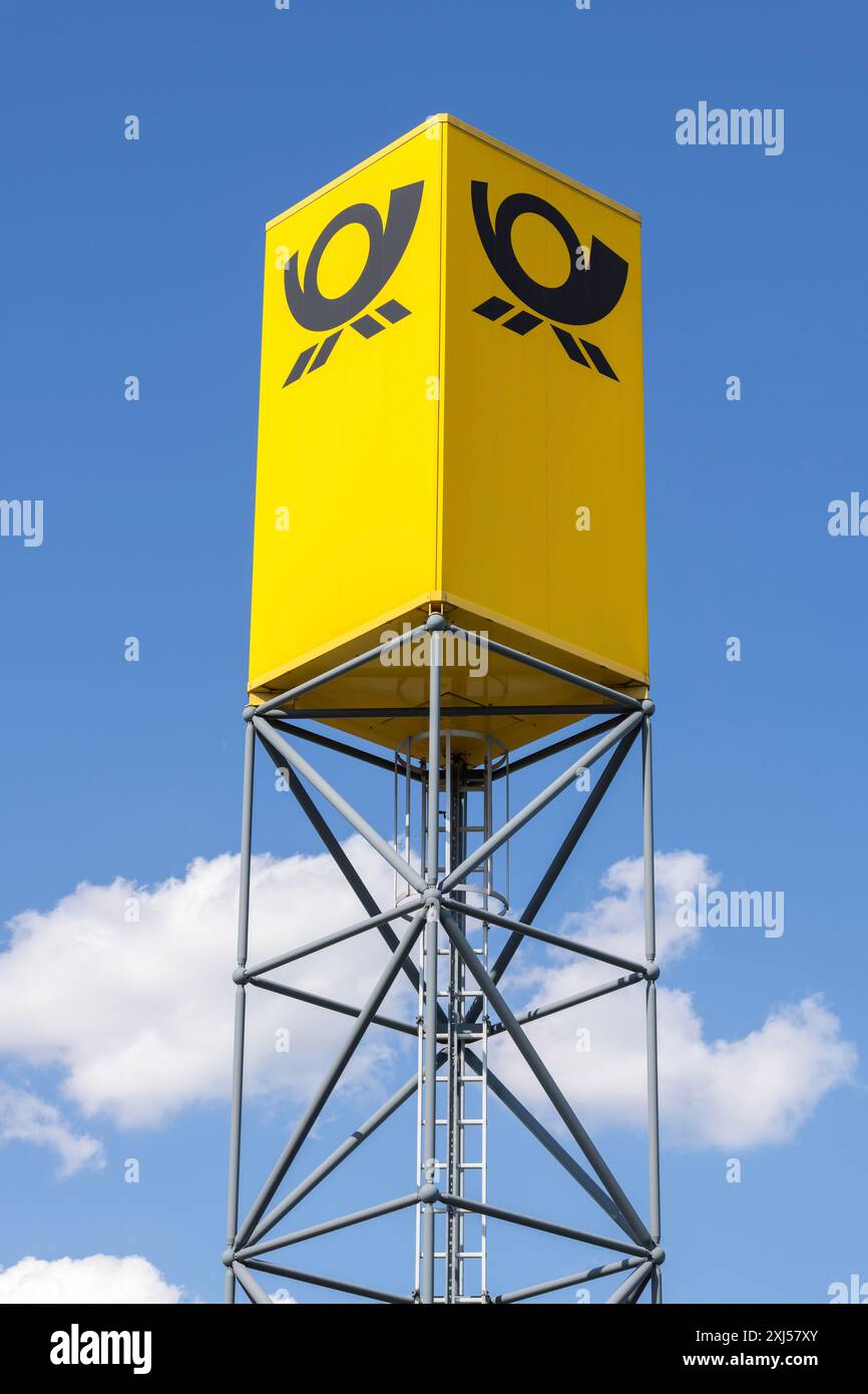Deutsche Post logo on a scaffold, DHL, blue sky with clouds, Baden ...