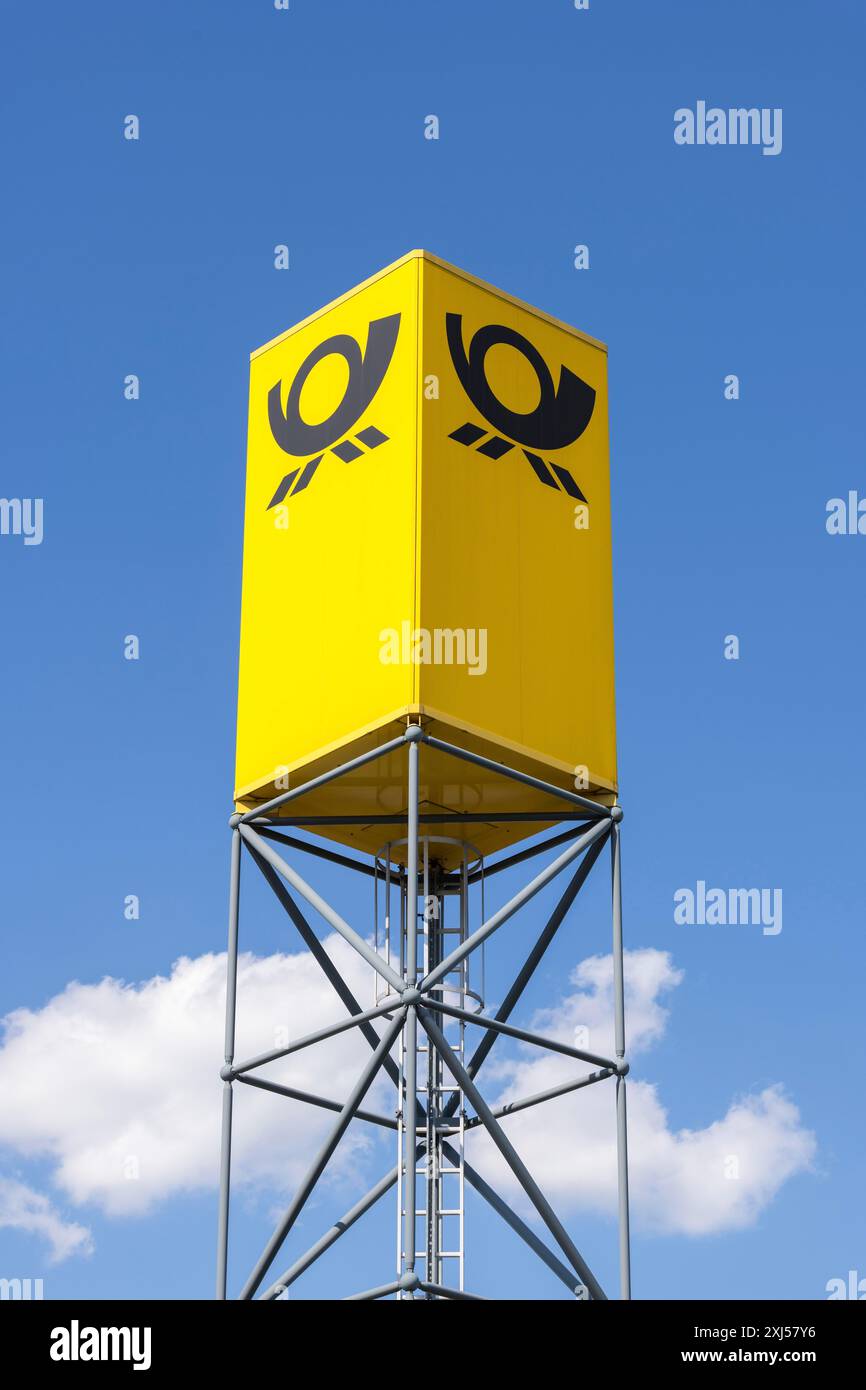 Deutsche Post logo on a scaffold, DHL, blue sky with clouds, Baden ...