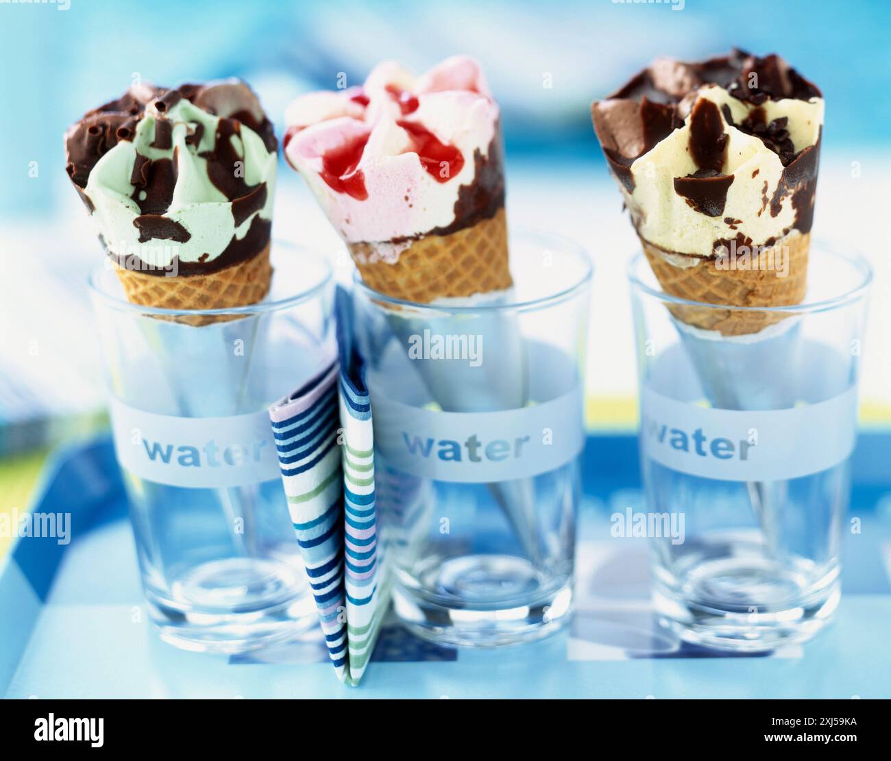 Three different flavored ice cream cones Stock Photo - Alamy