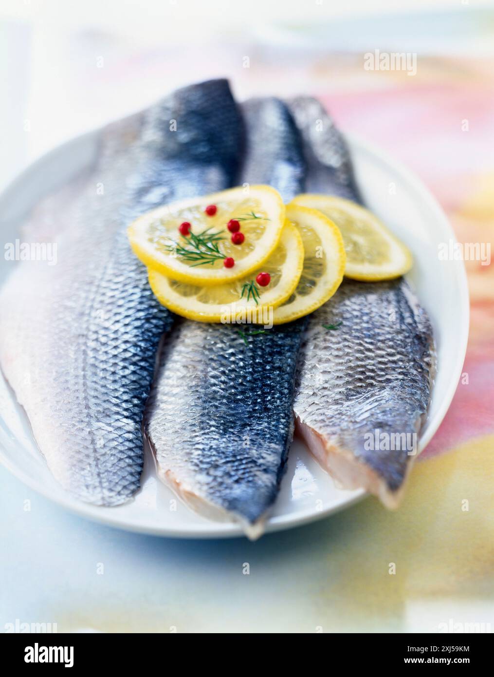 Raw bass fillets Stock Photo - Alamy