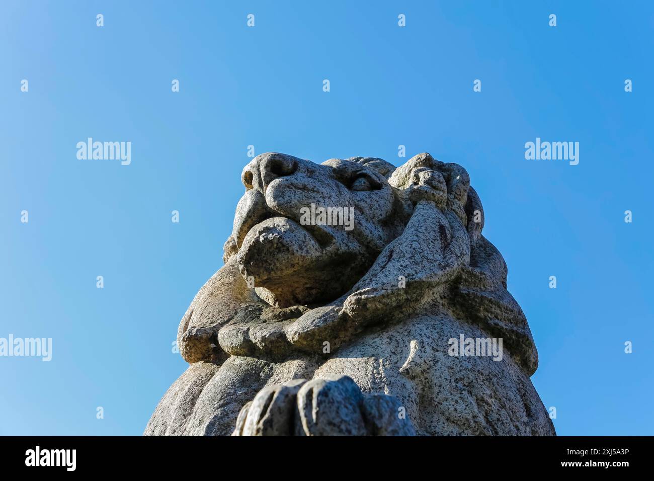 Resting lion made of granite on the terrace base of the equestrian ...