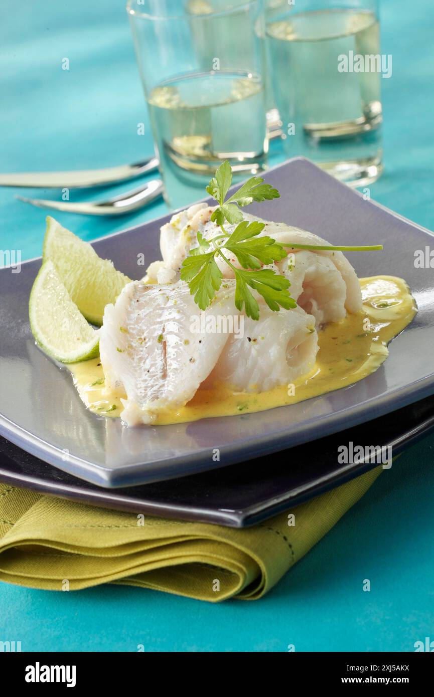 Rolled whiting fillets in curry sauce Stock Photo - Alamy
