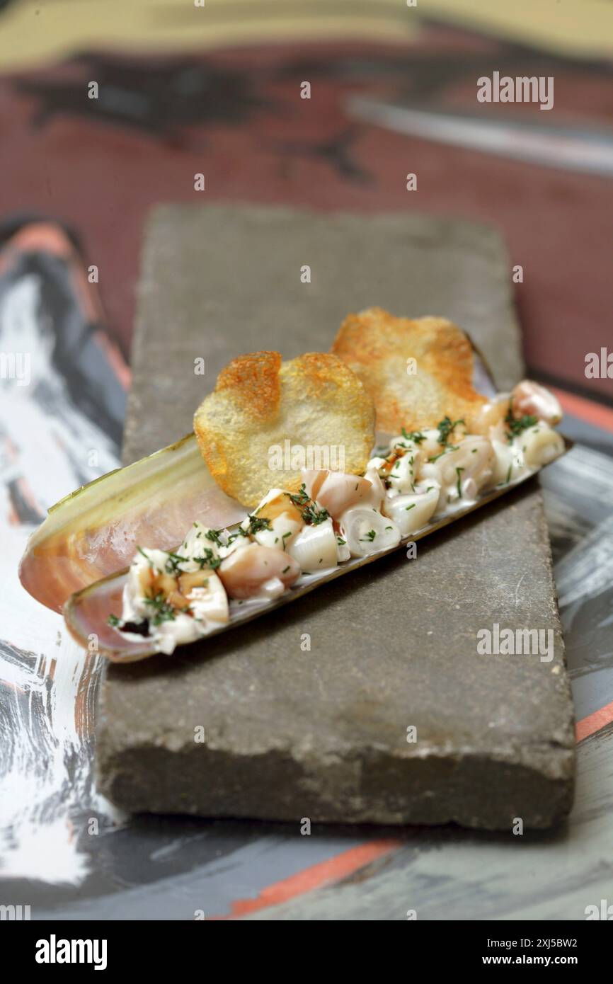 Razor clam with cream and chives Stock Photo - Alamy