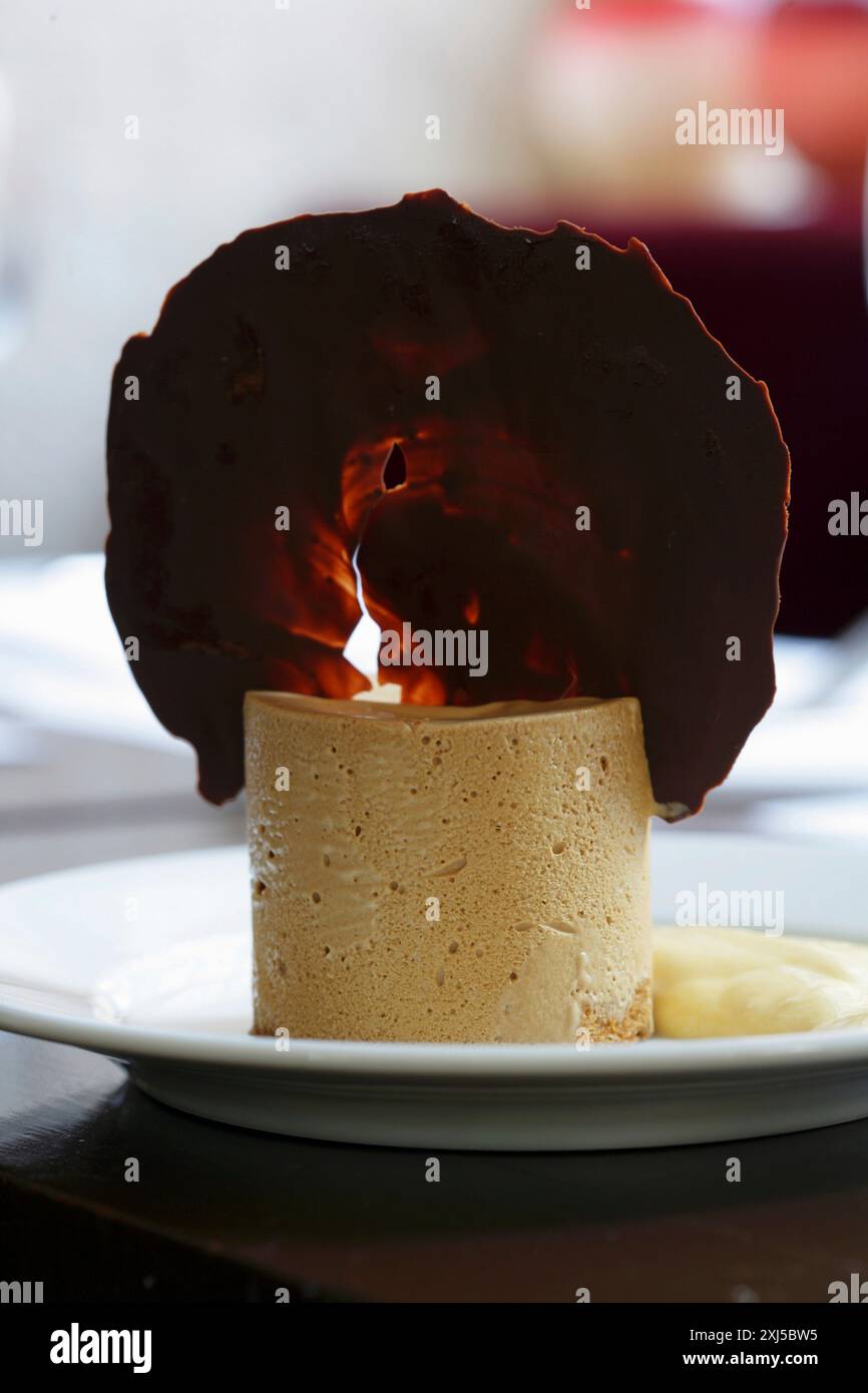 Almond-flavored mousse and chocolate tuile biscuit Stock Photo - Alamy