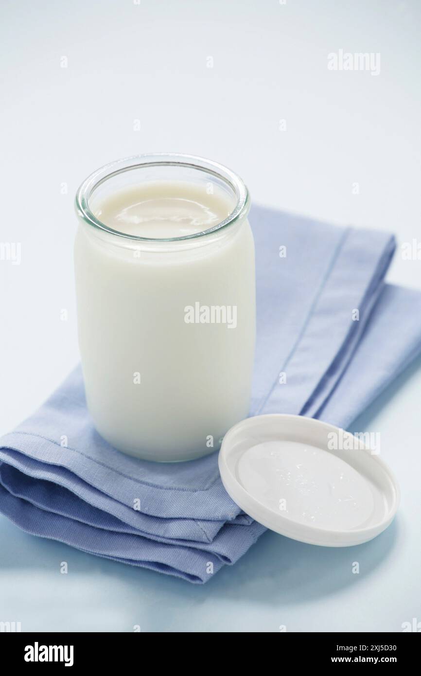 Plain yoghurt in a glass pot Stock Photo - Alamy