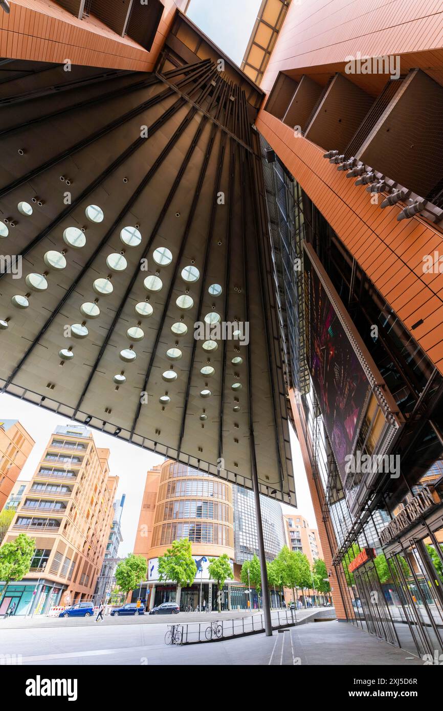 Tall, modern buildings with glass facades and geometric shapes that ...