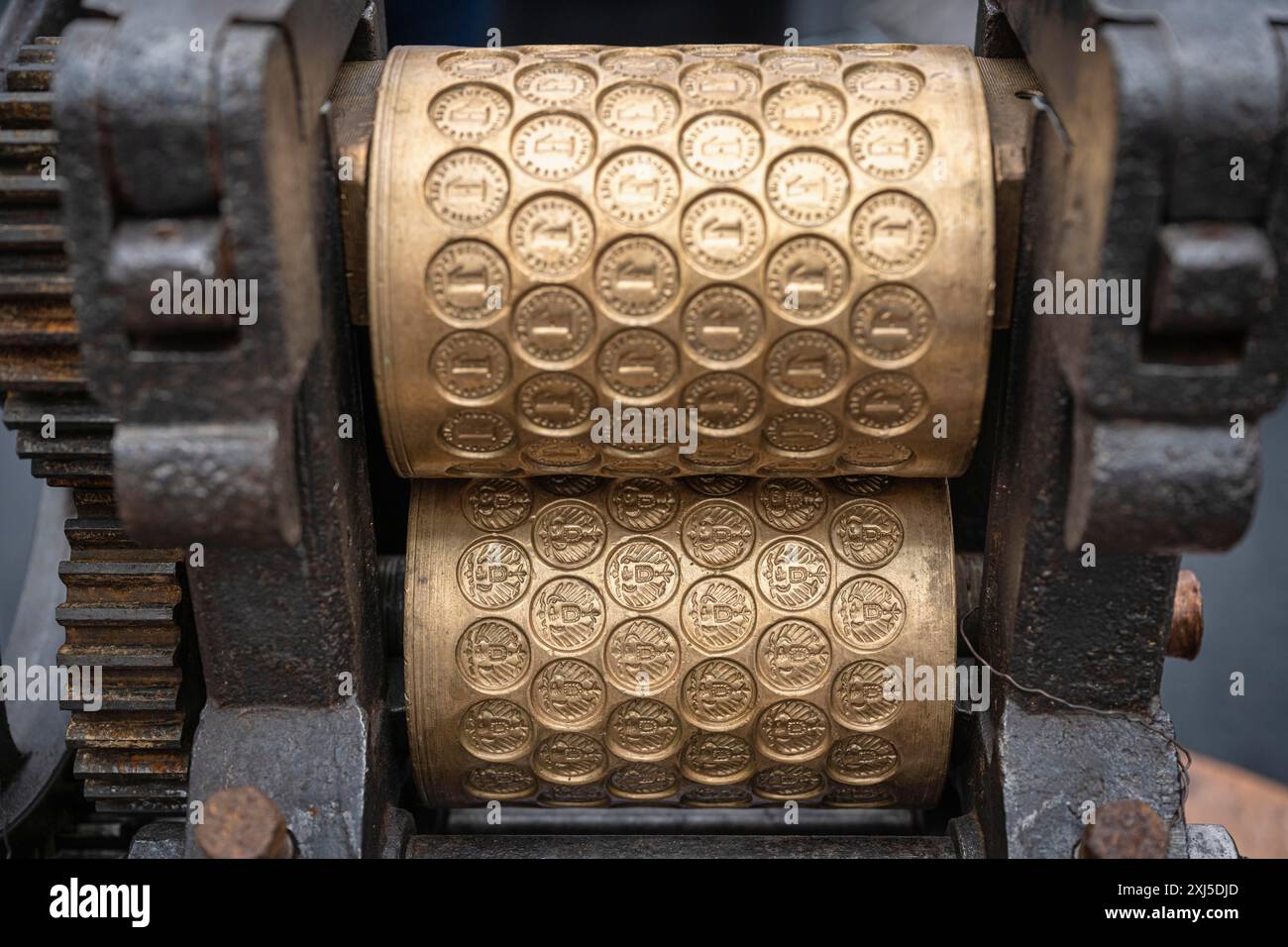 Old embossing machine with profiled metal rollers, machine parts ...