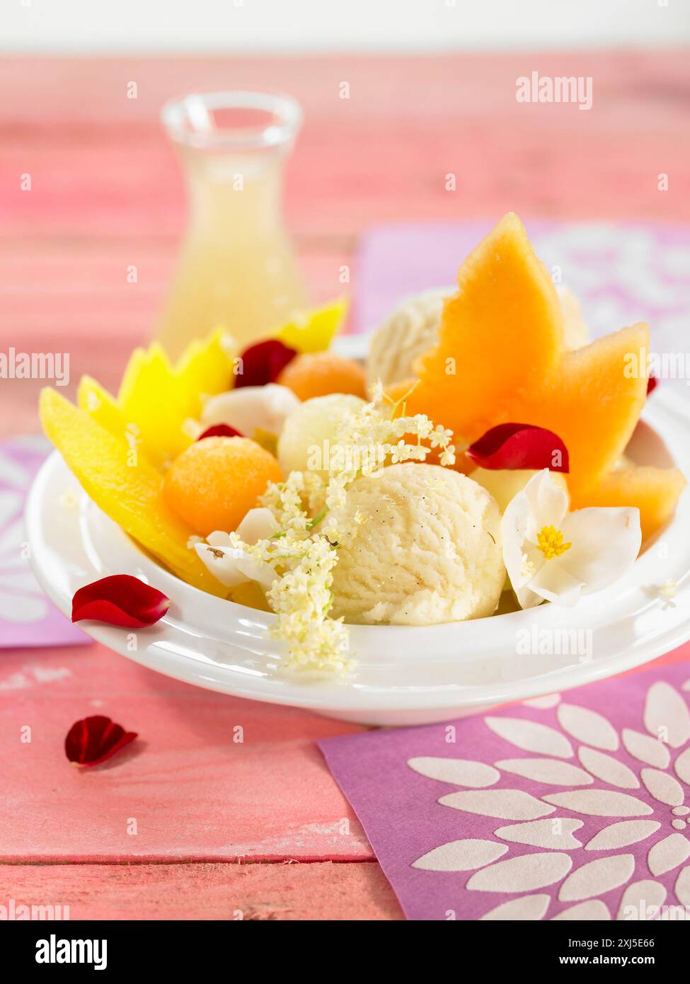 Melon and mango fruit salad with vanilla ice cream Stock Photo - Alamy